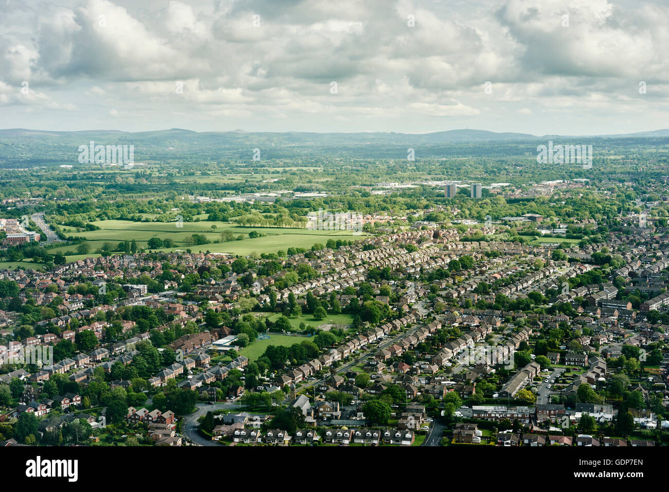 Aerial view of suburban housing and distant landscape, England, UK ...
