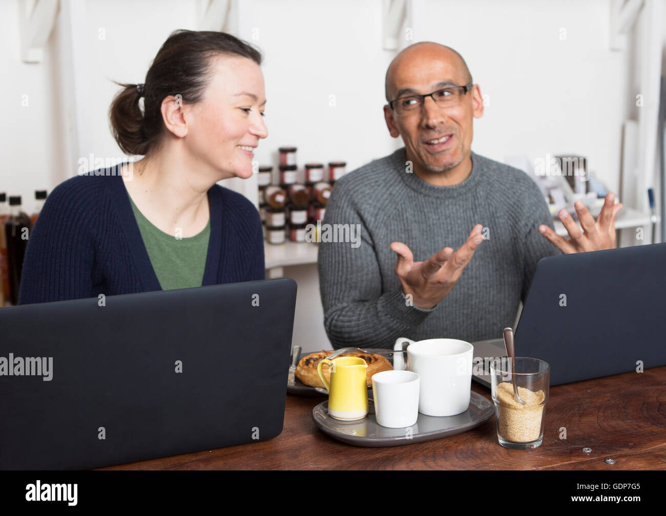 Mature woman sitting cafe table hi-res stock photography and images - Alamy