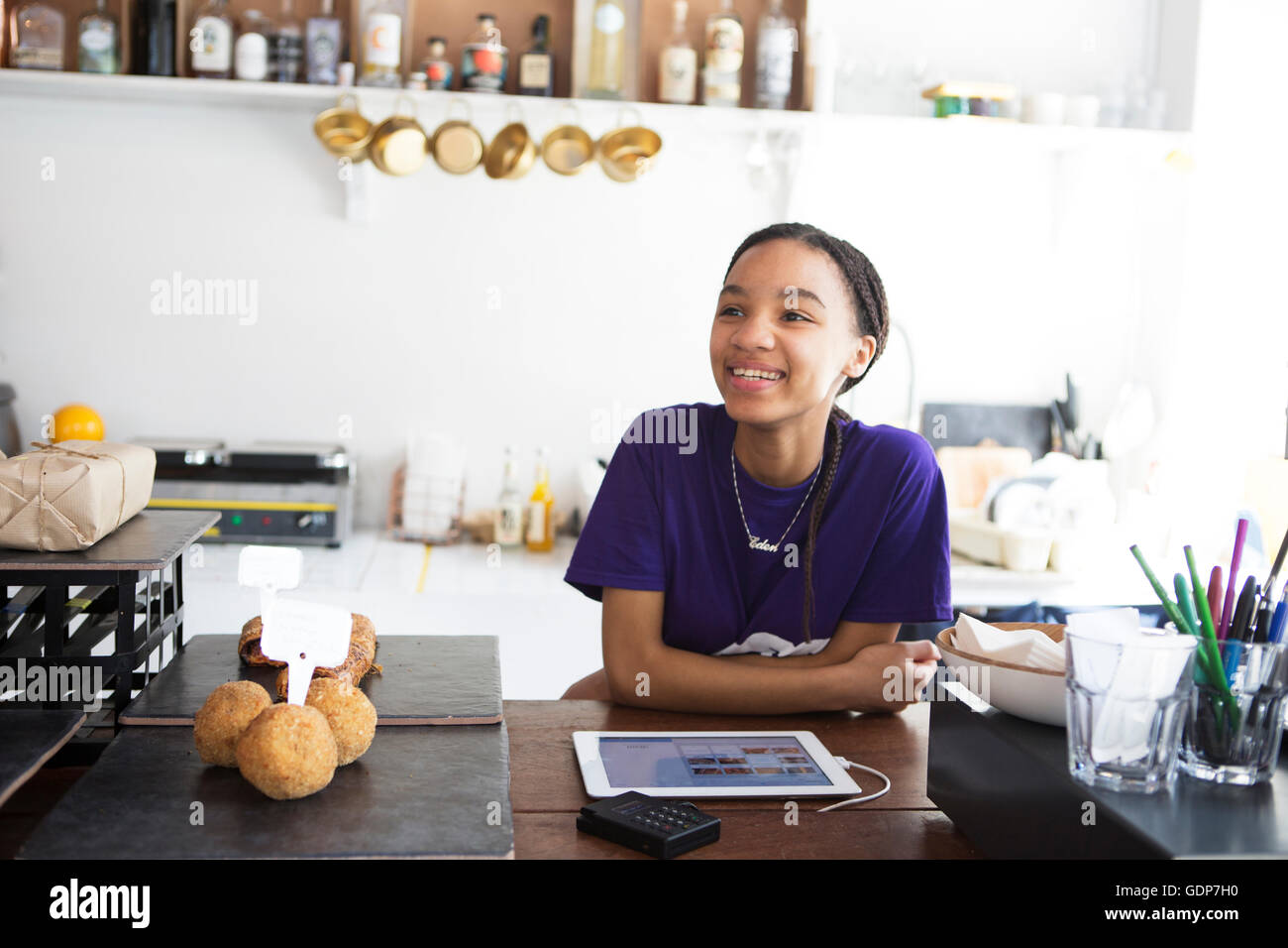 Smiling waitress crossed arms hi-res stock photography and images - Alamy