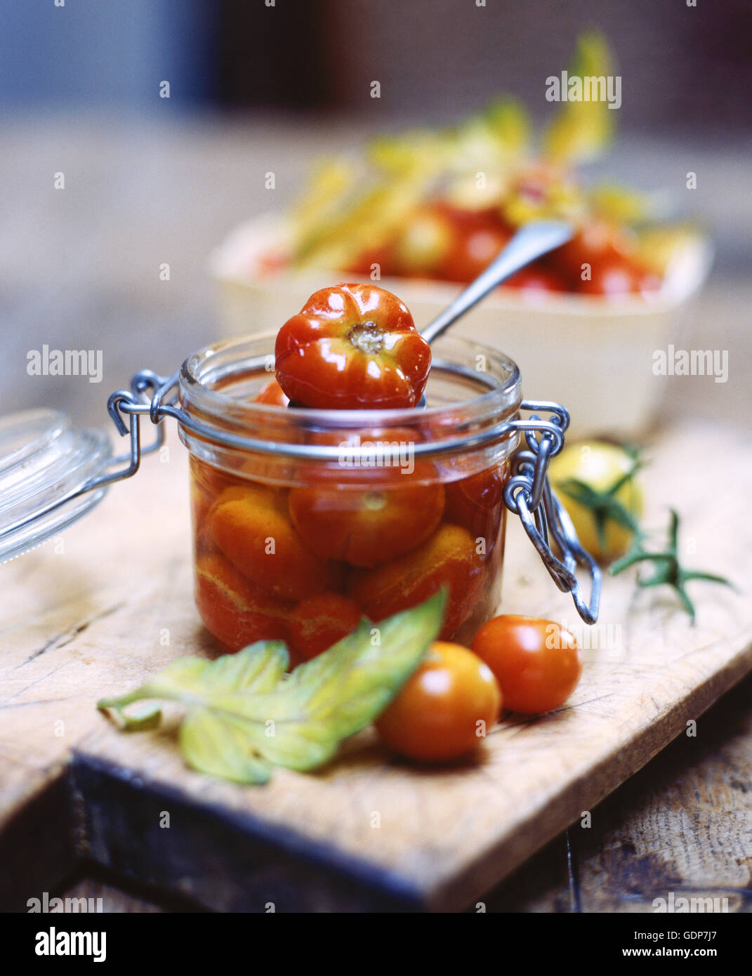 Heritage tomatoes in glass jar Stock Photo - Alamy