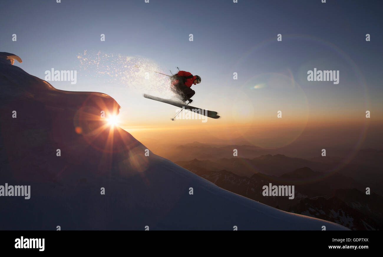 Skier in mid air on mountain slope hi-res stock photography and images ...