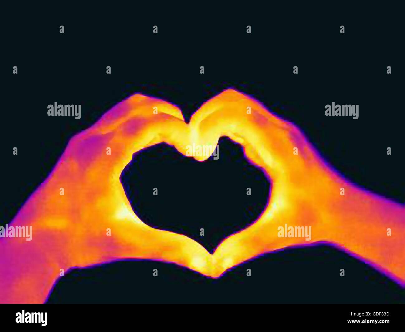 Thermal image of woman's hands making a heart shape Stock Photo - Alamy