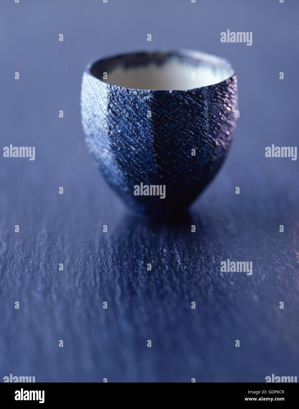Small black pot, close-up Stock Photo - Alamy