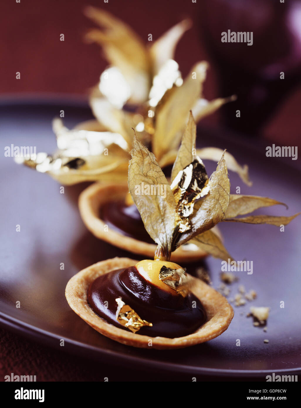 Cape gooseberry chocolate tarts Stock Photo - Alamy