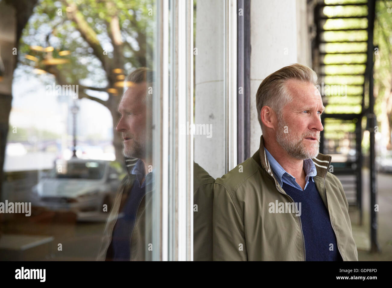 Man leaning against window hi-res stock photography and images - Alamy