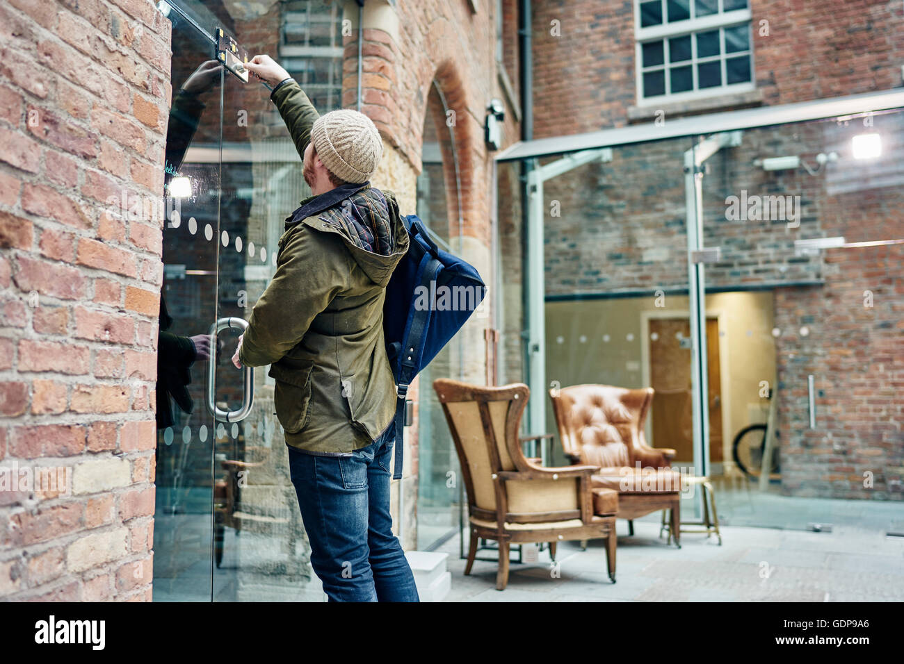 Man unlocking door hi-res stock photography and images - Alamy