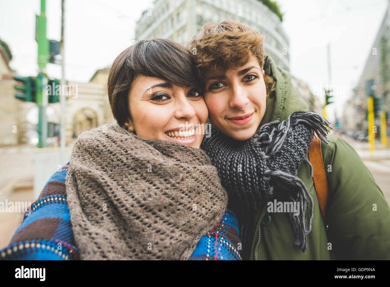 Portrait of two sisters, smiling, outdoors Stock Photo - Alamy