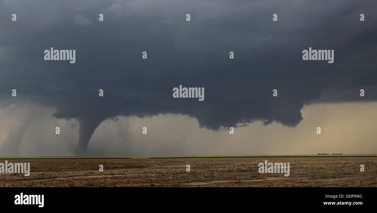 Large cone tornado touches down over the open prairie Stock Photo - Alamy
