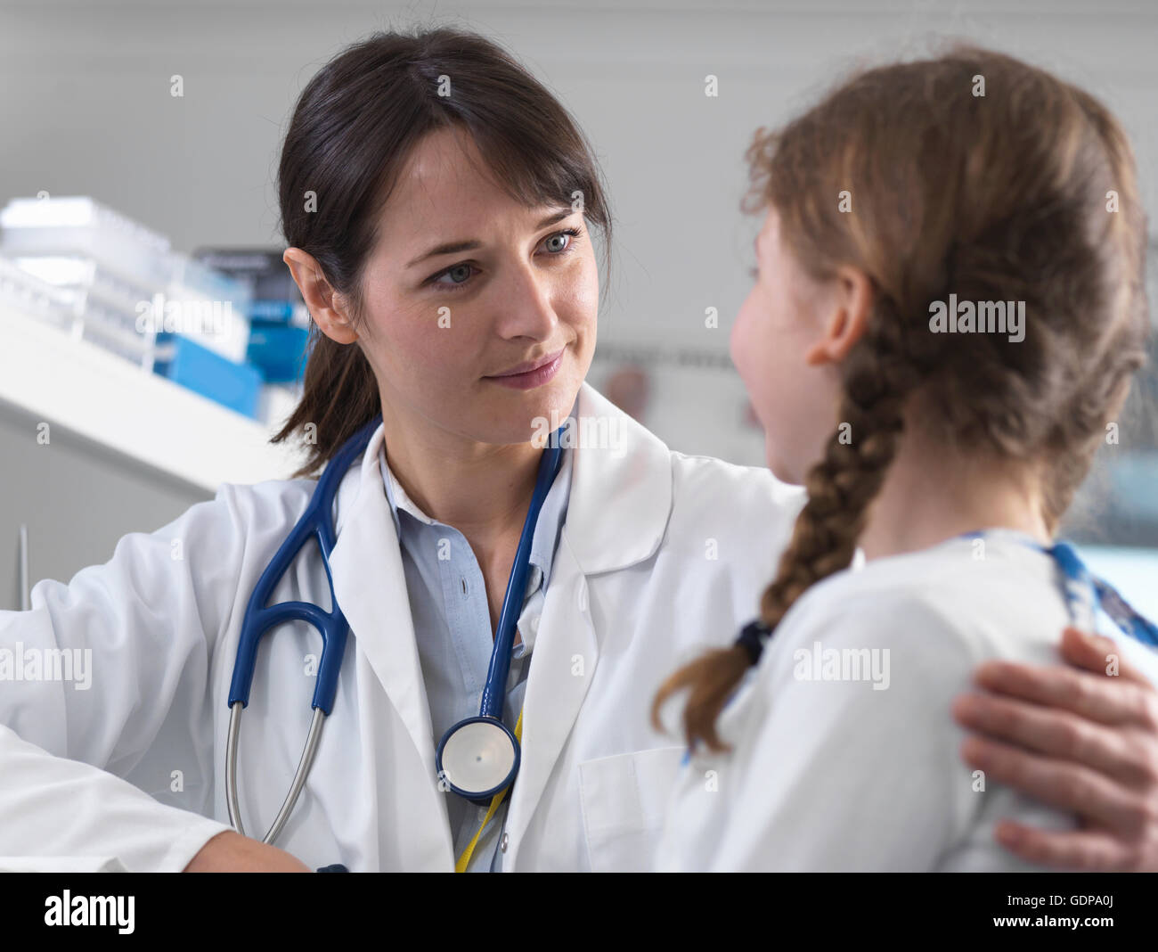Pediatrician consulting with girl Stock Photo - Alamy