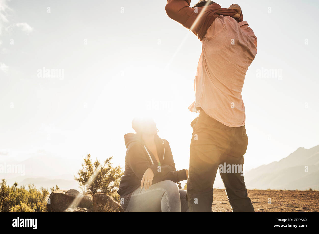 Woman removing her sweater hi-res stock photography and images - Alamy