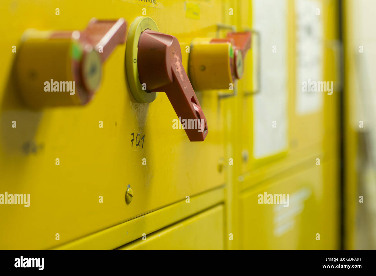 Close up of levers on yellow control panel Stock Photo - Alamy