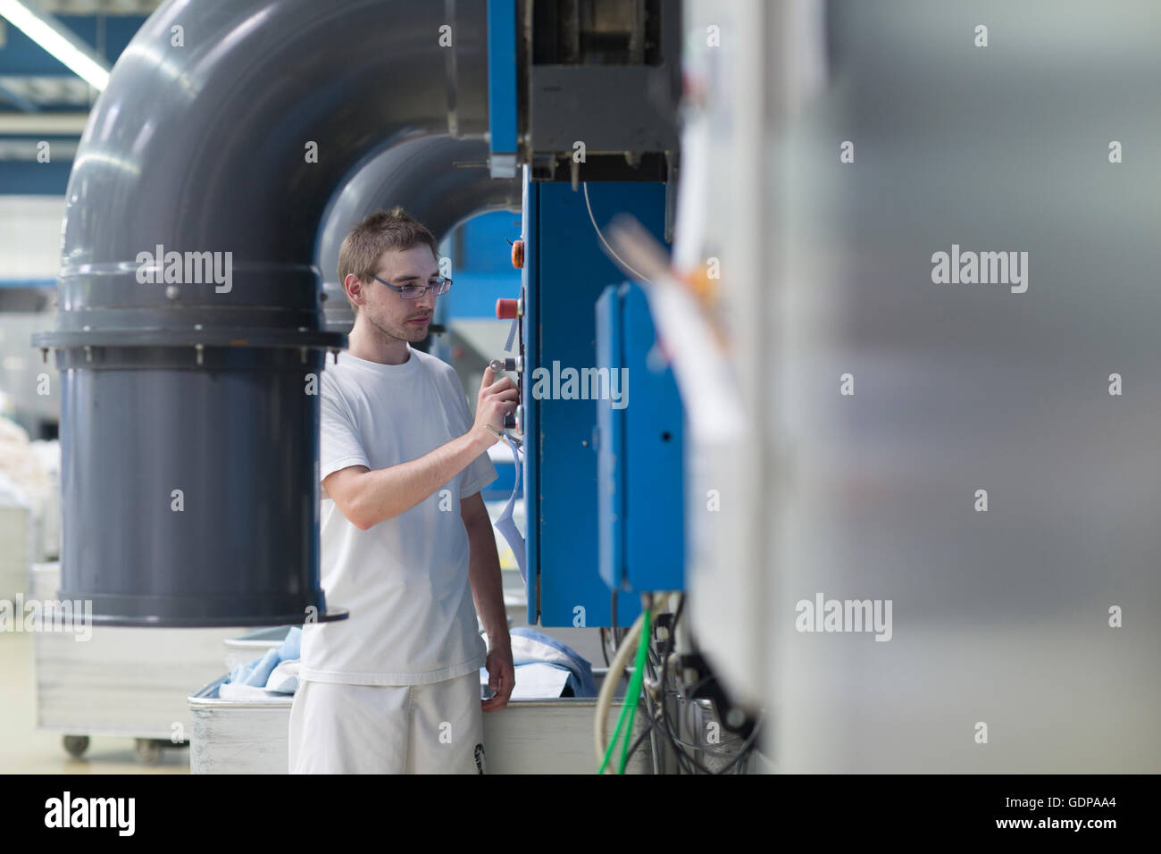 Man adjusting control panel Stock Photo - Alamy