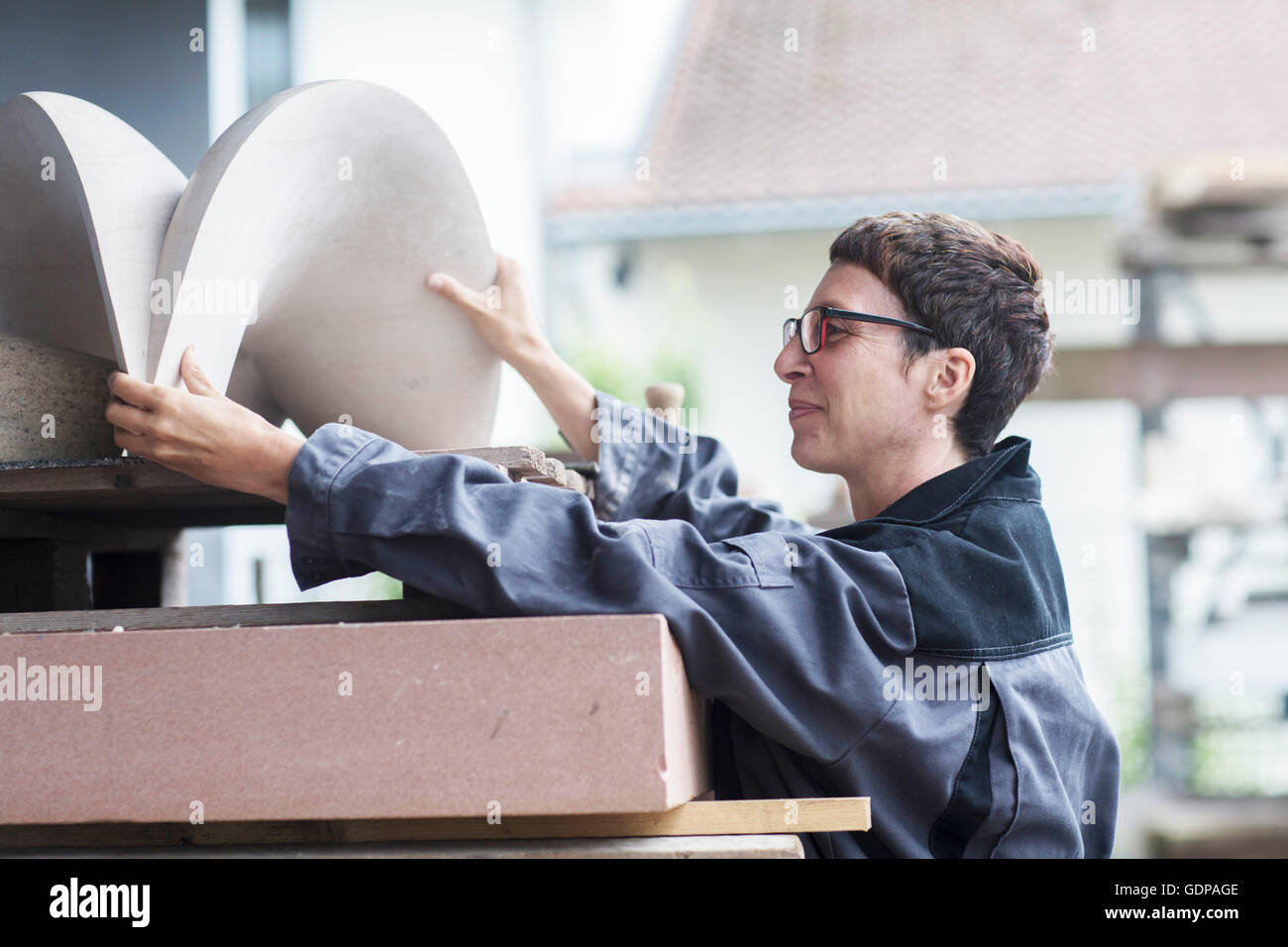 Lifting stone hi-res stock photography and images - Alamy