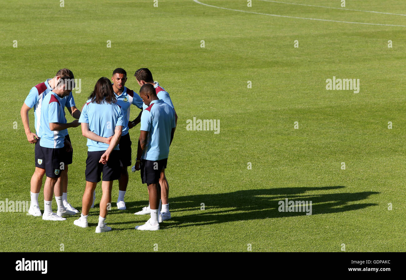 Burnley players on the sun drenched pitch at the Globe Arena before the ...