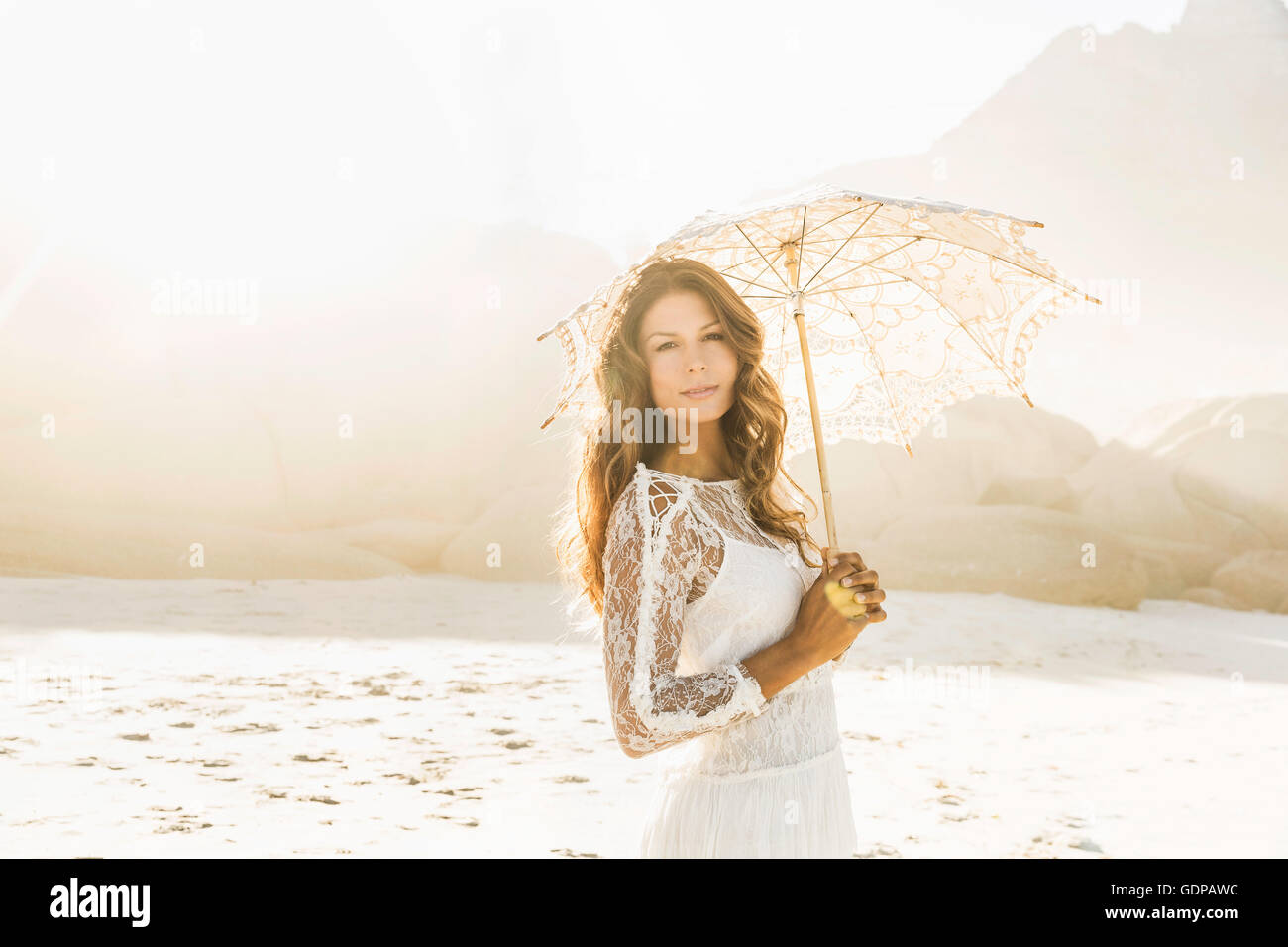 Woman holding parasol hi-res stock photography and images - Alamy