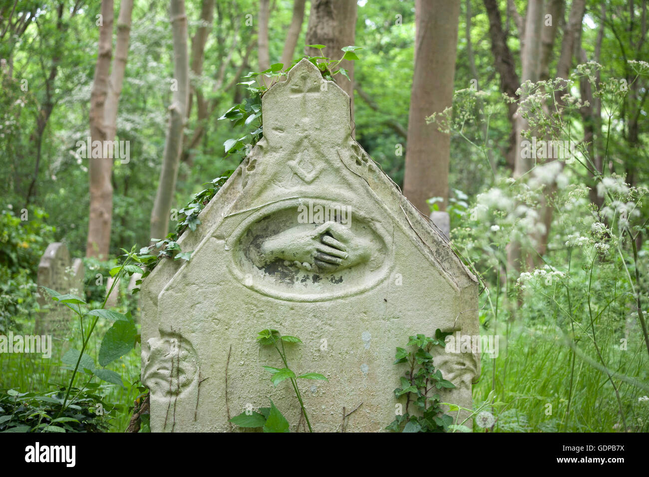 Square and compasses and shaking hands depicting symbols of freemasonry ...
