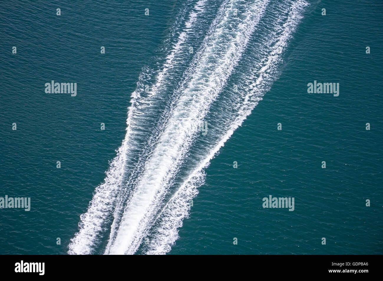 Trail on sea surface behind of speed boats Stock Photo - Alamy