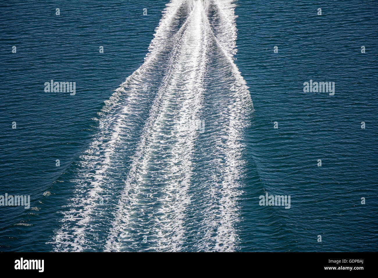 Trail on sea surface behind of speed boats Stock Photo - Alamy
