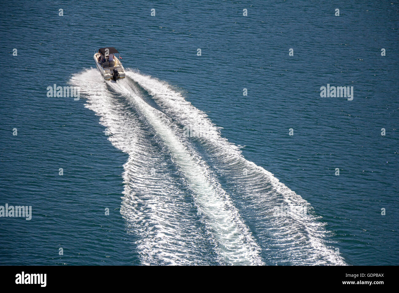 Trail on sea surface behind of speed boats Stock Photo - Alamy