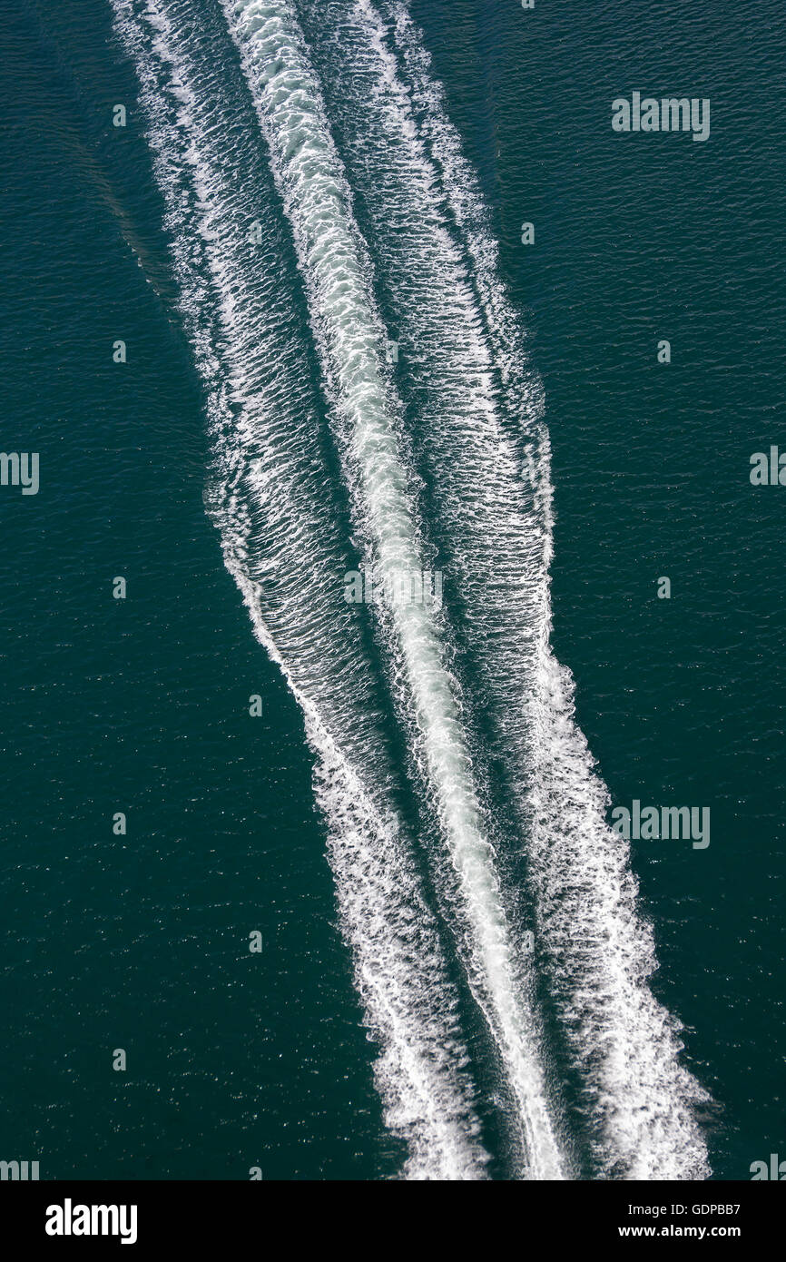 Trail on sea surface behind of speed boats Stock Photo - Alamy