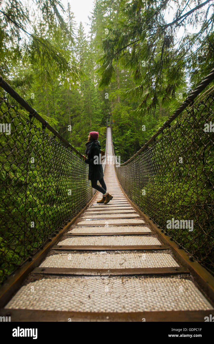 Woman on Lynn canyon suspension bridge, North Vancouver, British ...