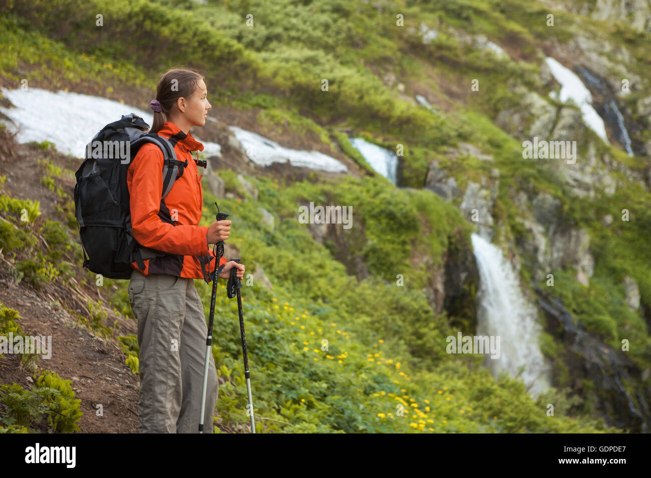 Tourist with a backpack and mountain panorama Stock Photo - Alamy