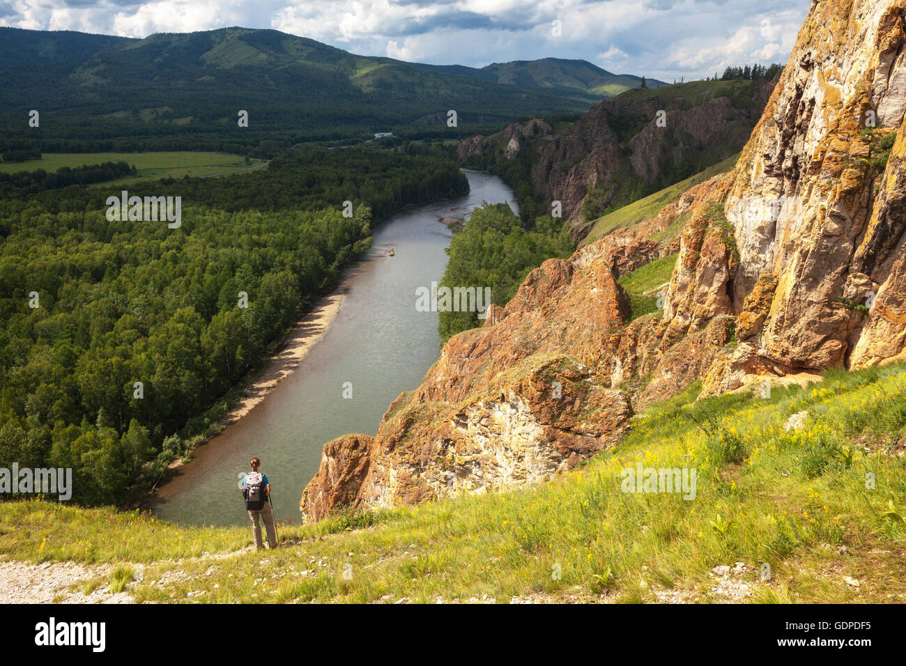 Tourist with a backpack and mountain panorama Stock Photo - Alamy