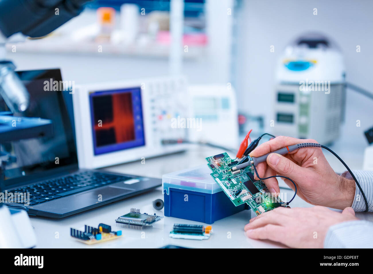 Using the microscope electronics laboratory Stock Photo - Alamy