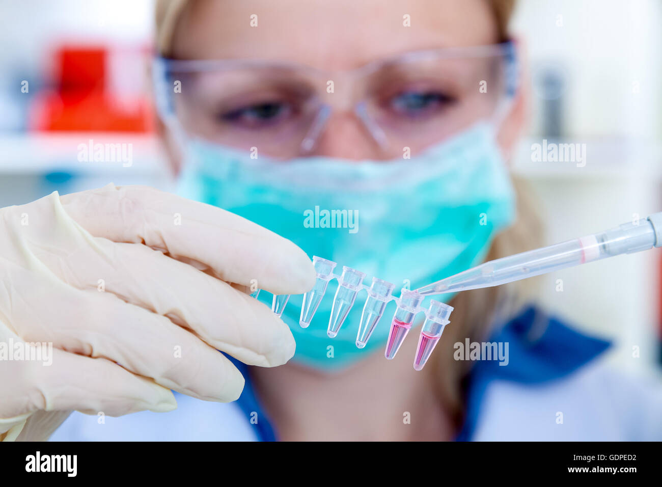 Girl in face mask in laboratory Stock Photo - Alamy