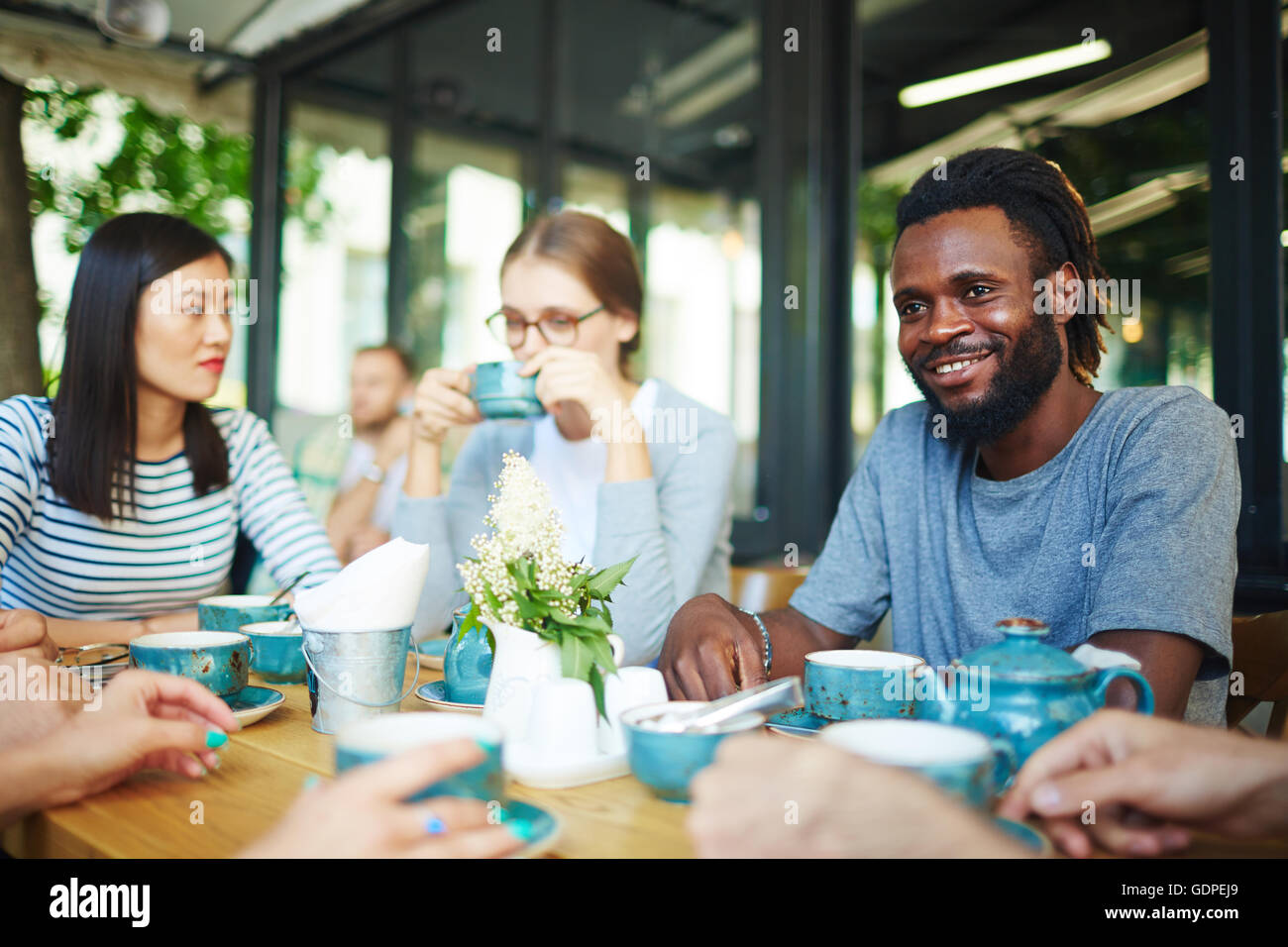 Friends in cafe Stock Photo - Alamy