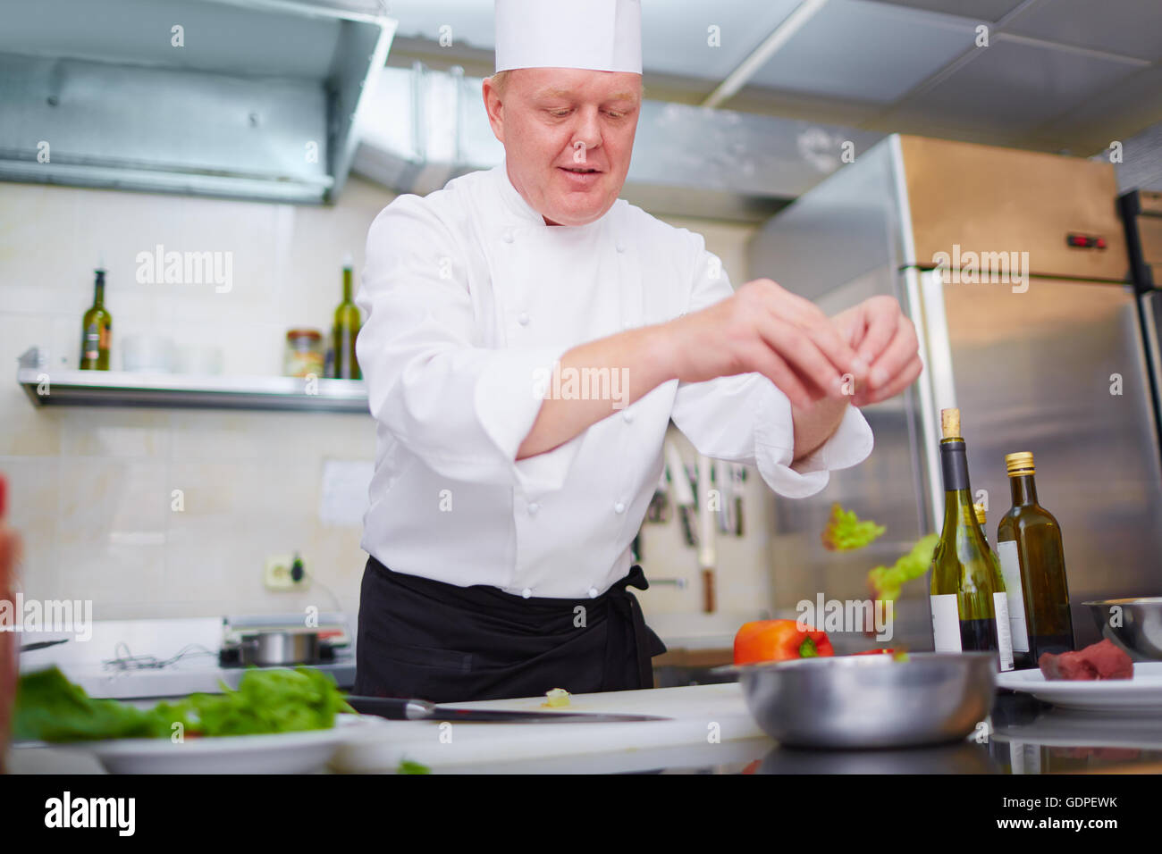 Person cooking meal hi-res stock photography and images - Alamy