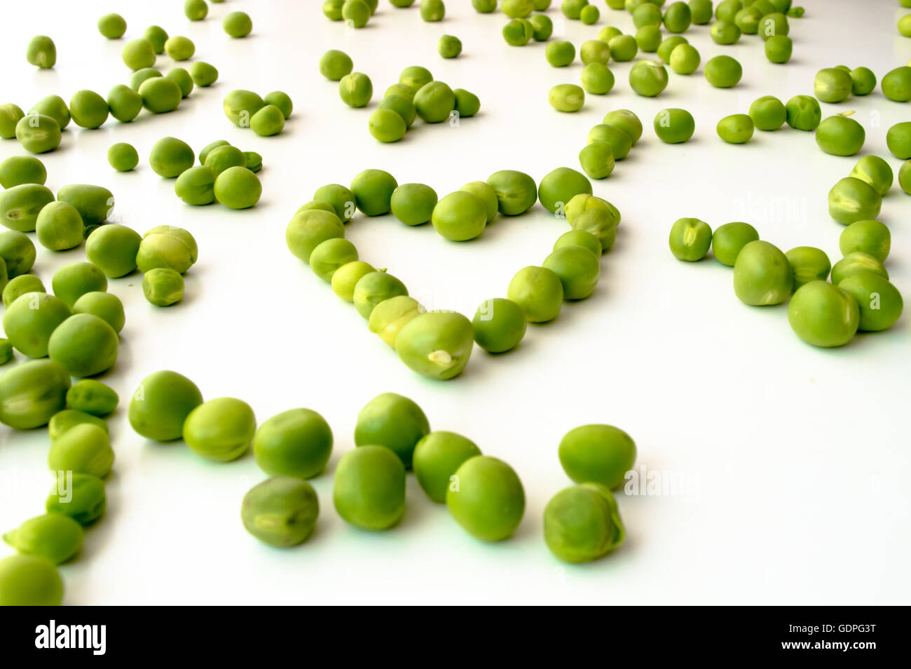 Heart Figure Made With Peas on White Background Stock Photo - Alamy