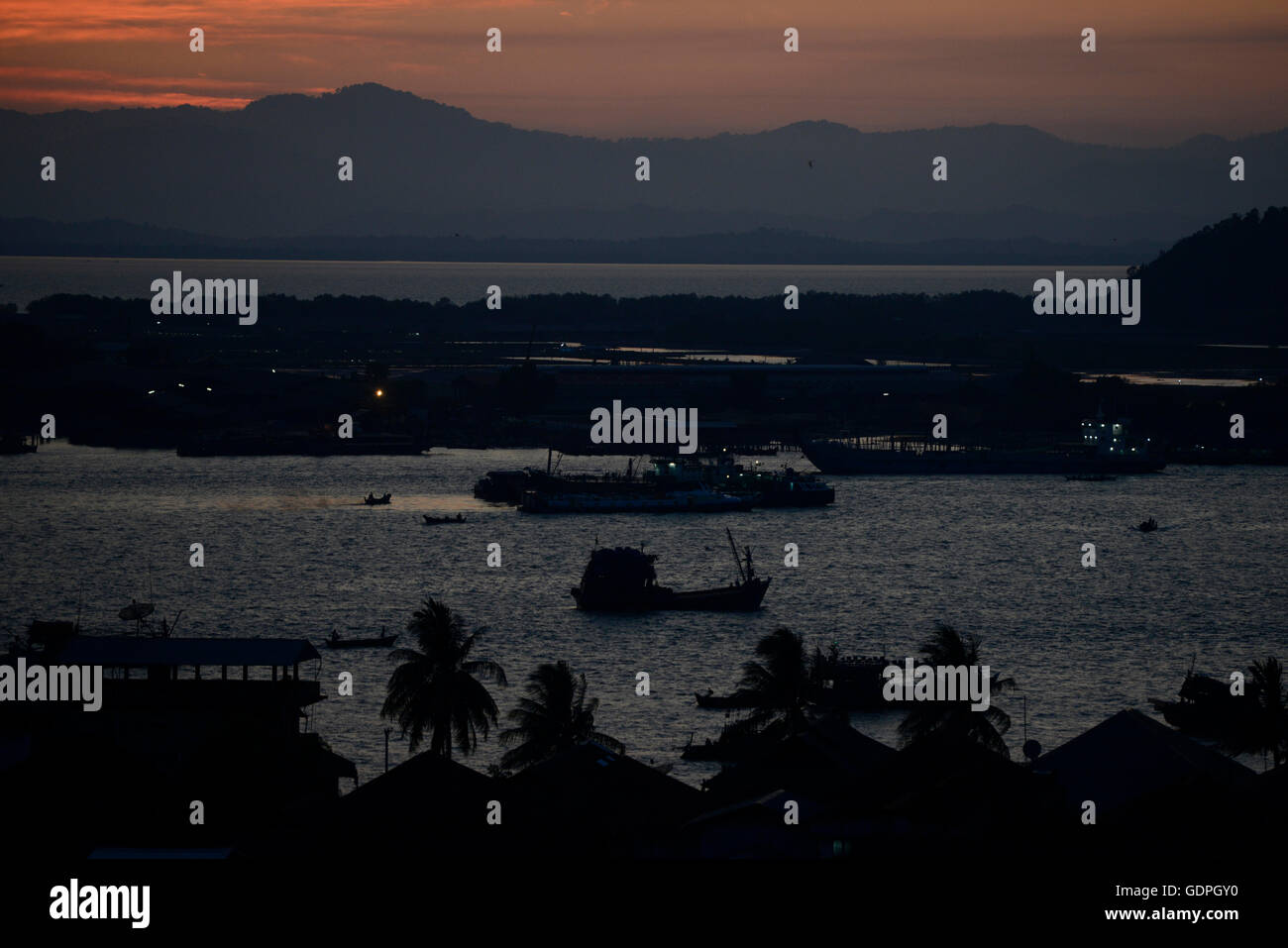 the sunset at the Harbour at the coast of the Andaman sea of Myeik in ...