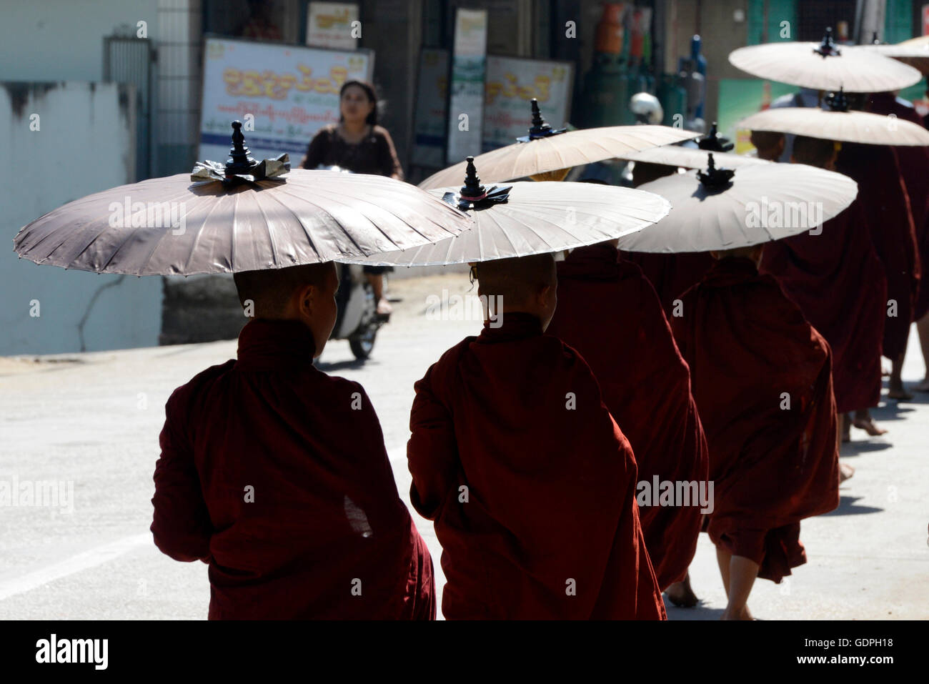 Monks on the road in the city centre of Myeik in the south in Myanmar ...