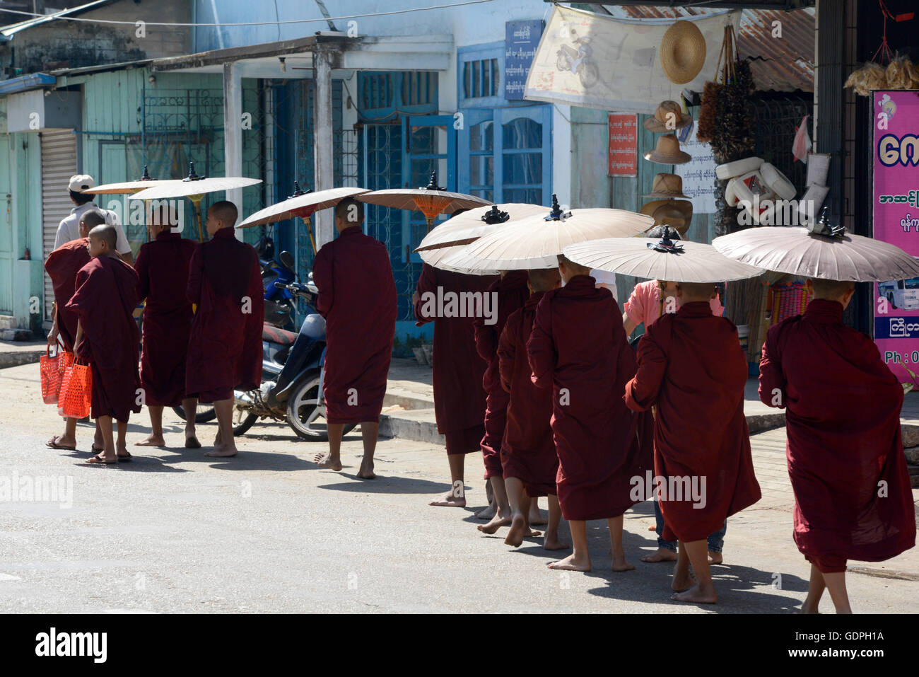 Monks on the road in the city centre of Myeik in the south in Myanmar ...