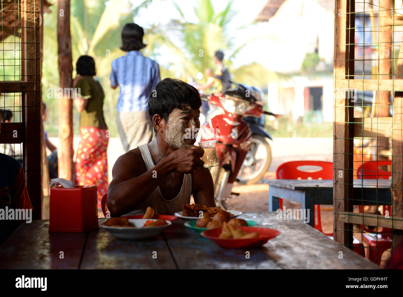 a men in a restaurant on the Mainroad in a village near the city of ...