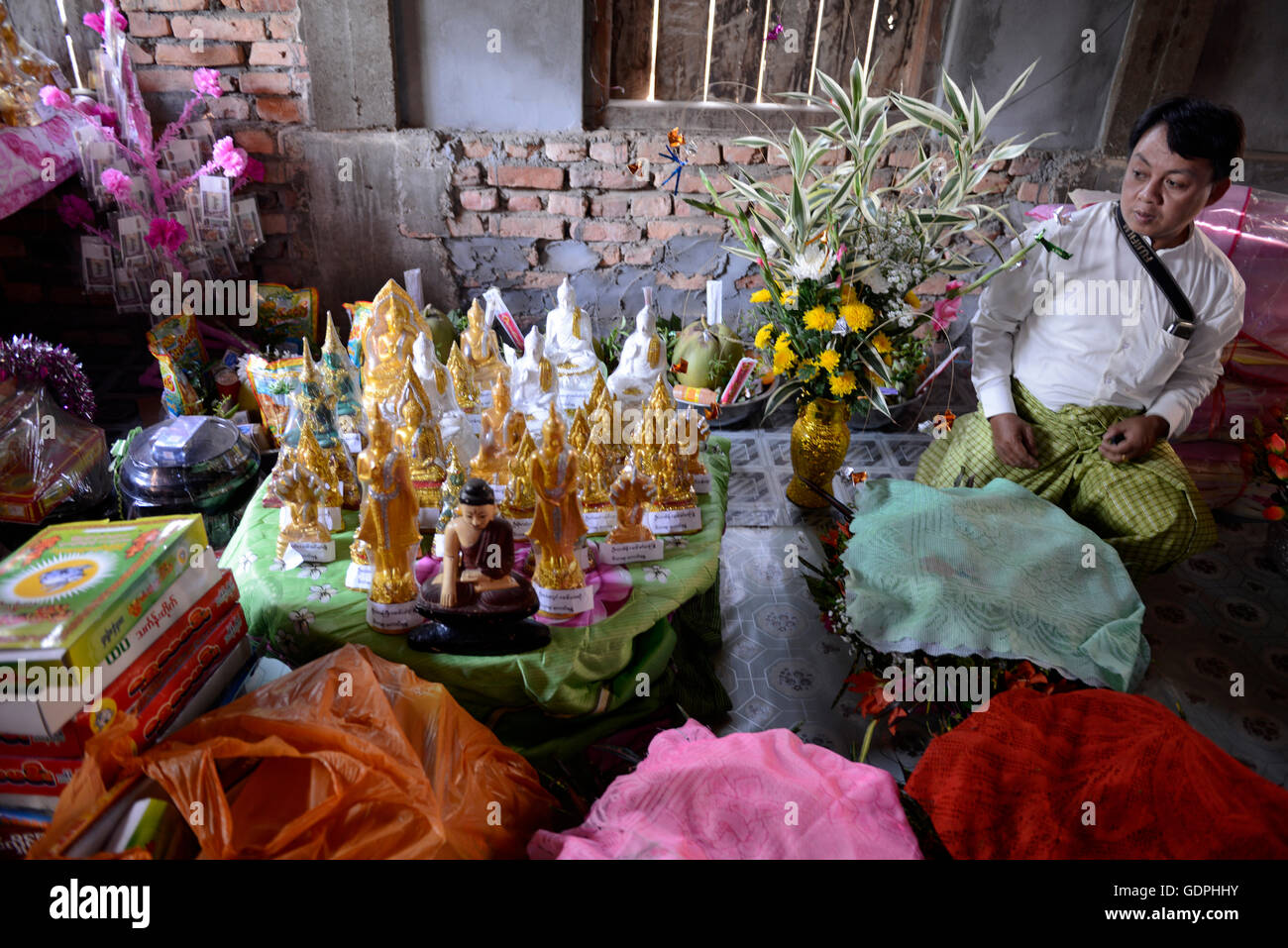 people in traditional dress at a shinpyu ceremony in a village neat the ...