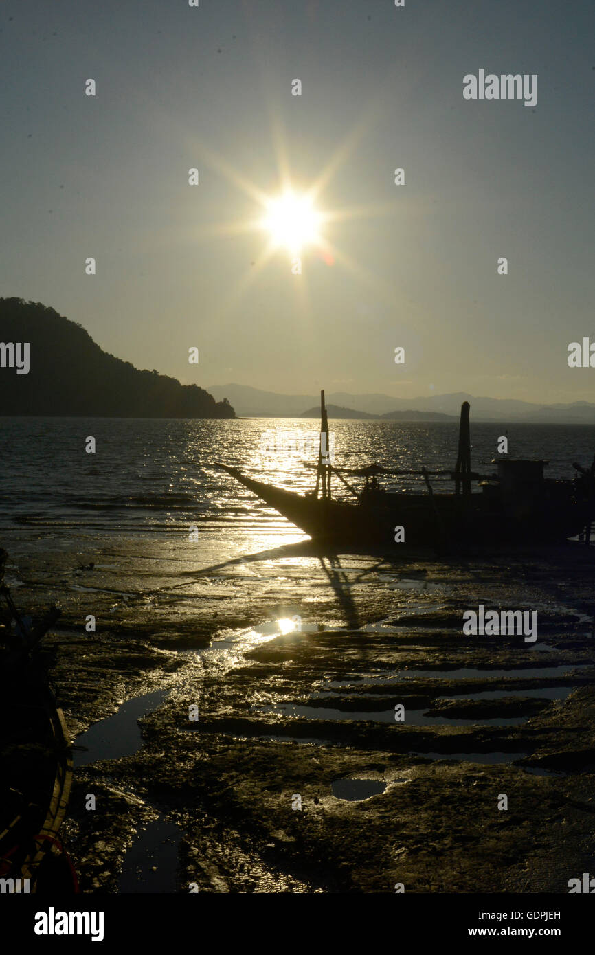 the sunset at the Harbour at the coast of the Andaman sea of Myeik in ...