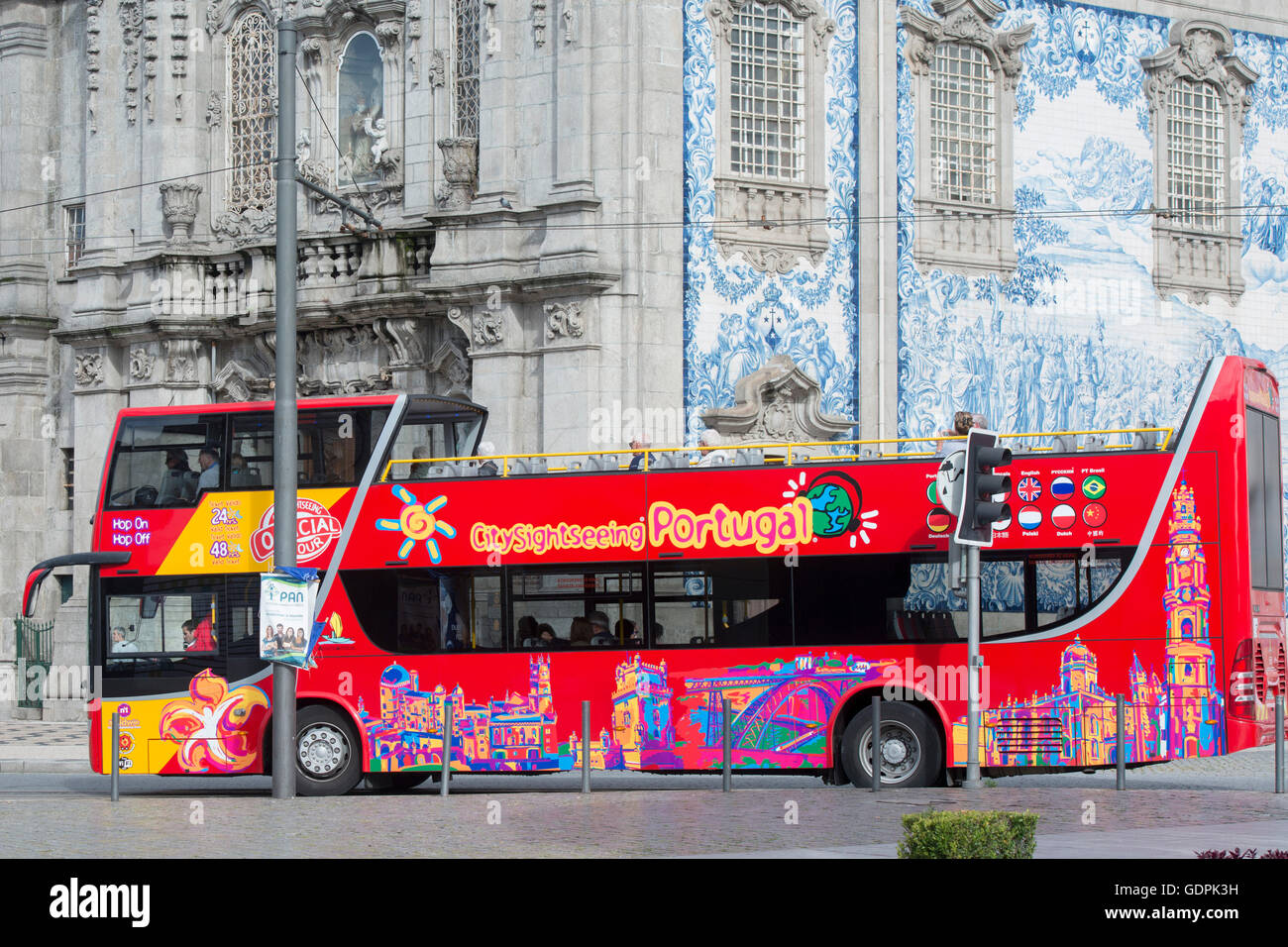a tourist bus in Ribeira in Ribeira in the city centre of Porto in ...
