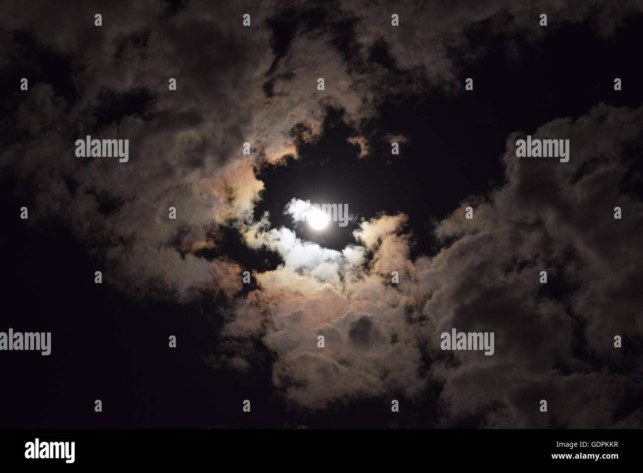 Moon behind clouds at night hi-res stock photography and images - Alamy
