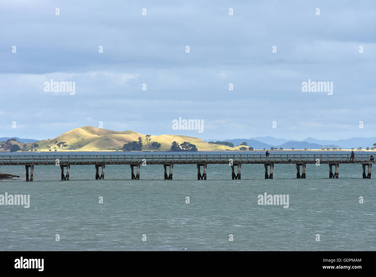Long wharf with small island in background Stock Photo - Alamy
