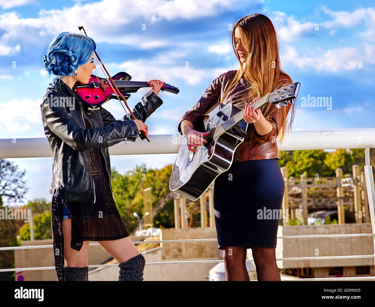 Music street performers with girl violinist Stock Photo - Alamy