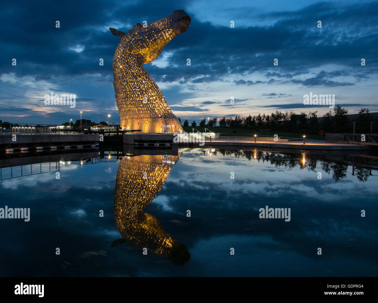 One of the Kelpies horse sculptures with water reflection in Helix park ...