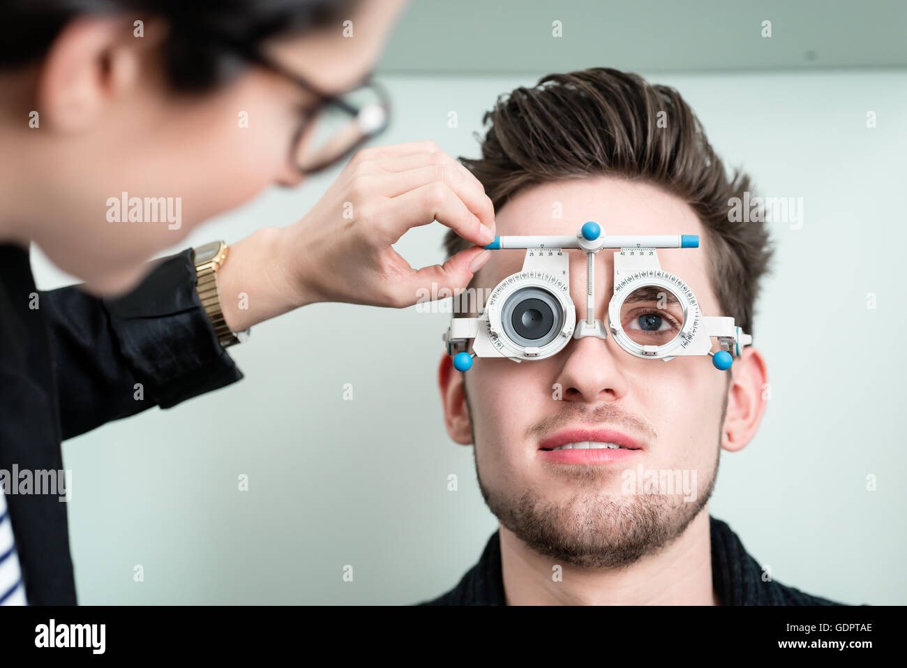 man-with-optician-at-eyesight-test-for-glasses-stock-photo-alamy
