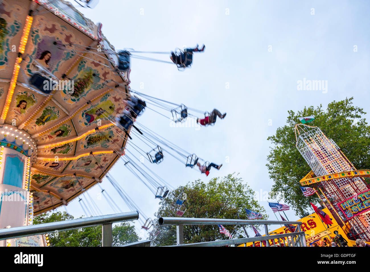 Flying Chairs and Helter Skelter. Traditional fairground rides at Goose ...