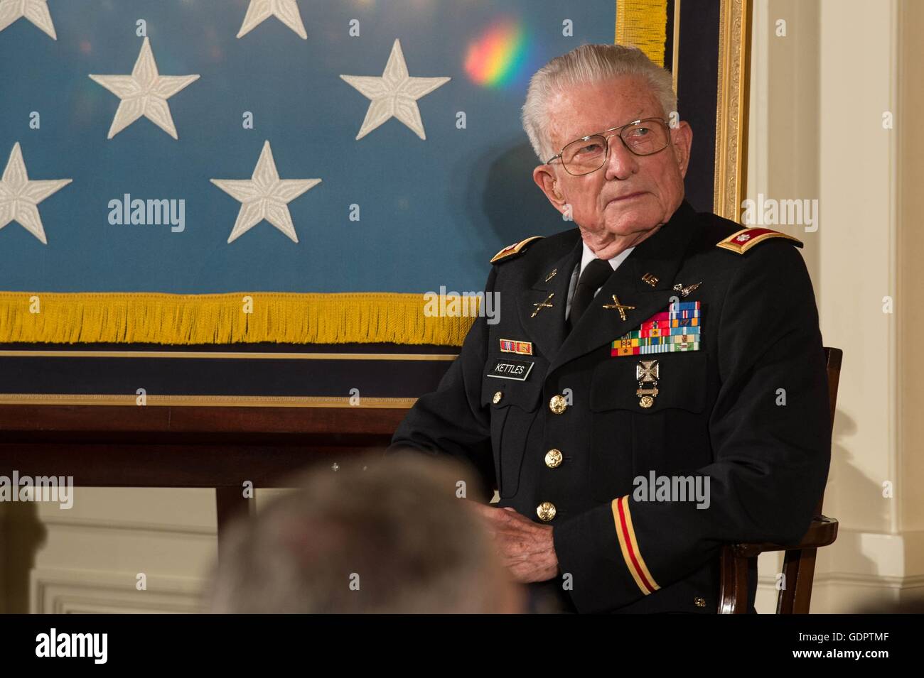 Retired U.S. Army Lt. Col. Charles Kettles listens to U.S President ...