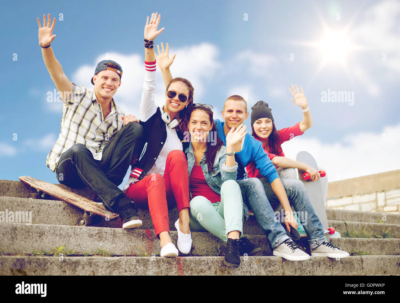 group of smiling teenagers hanging out Stock Photo - Alamy