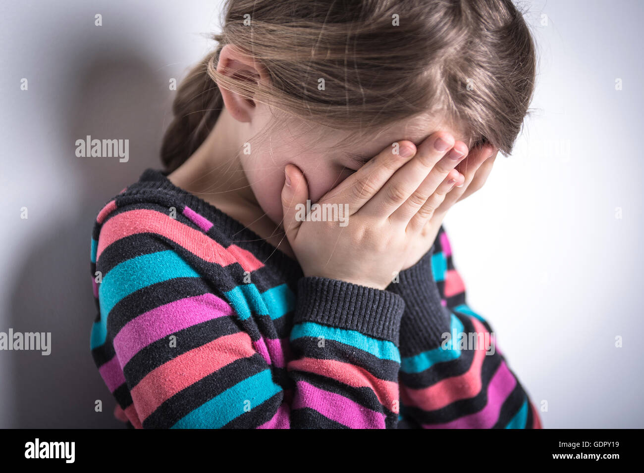 stressed sad girl on studio Stock Photo - Alamy
