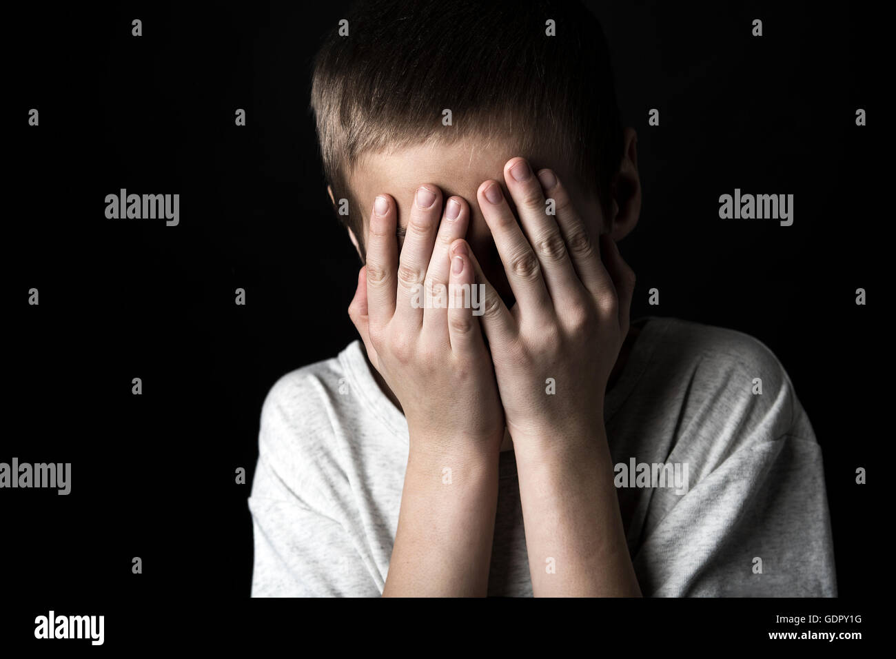 stressed sad boy on studio Stock Photo - Alamy