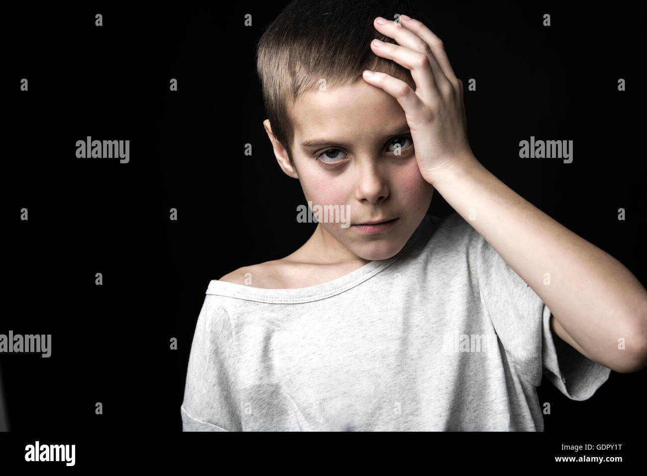 stressed sad boy on studio Stock Photo - Alamy